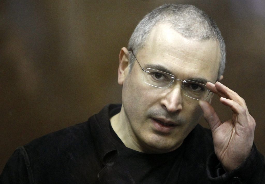 Jailed Russian former oil tycoon Khodorkovsky stands in the defendants ...